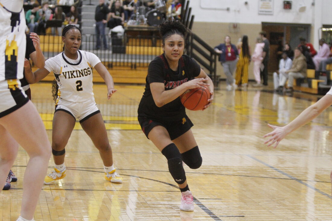 Lawrence boys and girls basketball teams pick up road wins over Shawnee ...